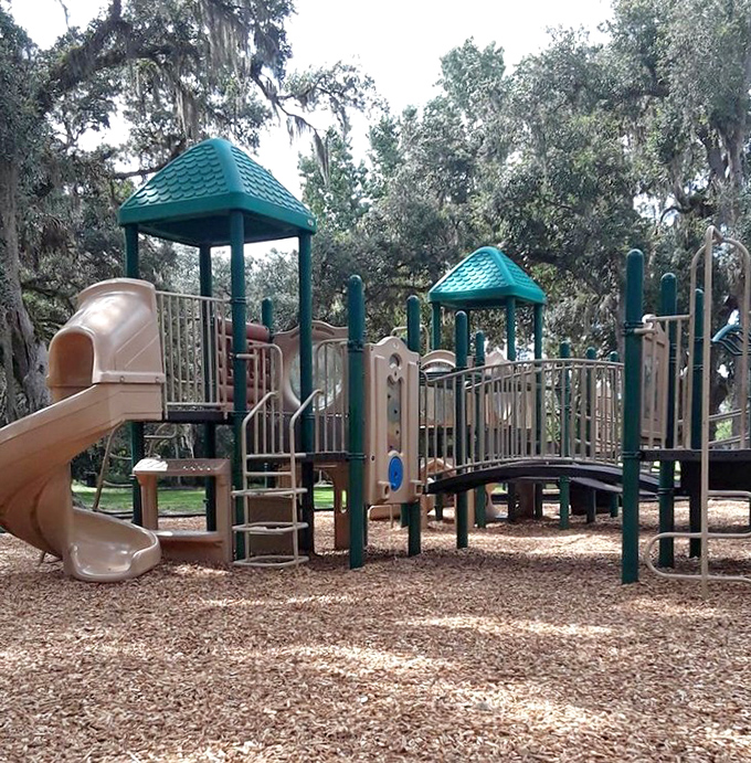 Kids climb where history meets playtime&mdash;this modern playground offers welcome energy release between pioneer history lessons.