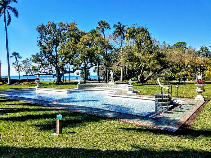 Even the reflecting pool seems to be showing off, mirroring palm trees and sky in a display that says, "Yes, we do everything with extra flair here."
