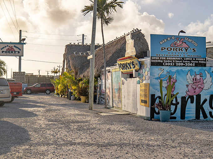 Porky's Bayside Restaurant's thatched roof and quirky signage promise the kind of laid-back dining experience that defines Keys cuisine.