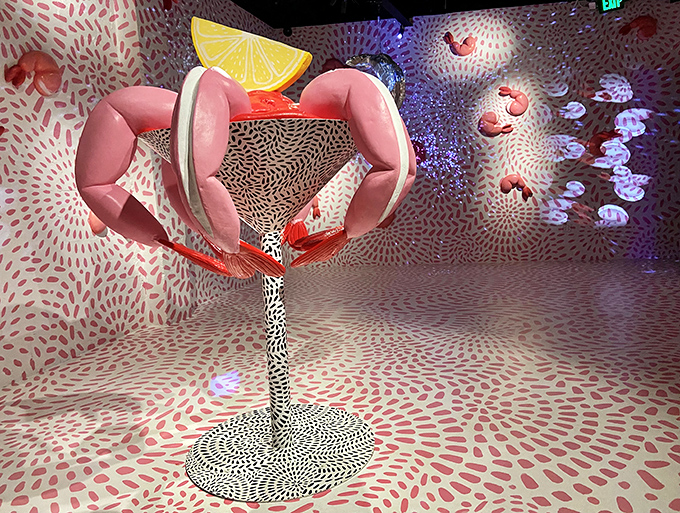 The Shrimpfinity installation reimagines cocktail garnish as high art. This cosmic shrimp cocktail serves surrealism with a twist of whimsy.