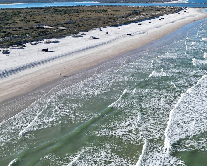 Aerial view of Smyrna Beach reveals its pristine shoreline and drive-on access, a rare treat for beachgoers who prefer convenience with their sunshine.