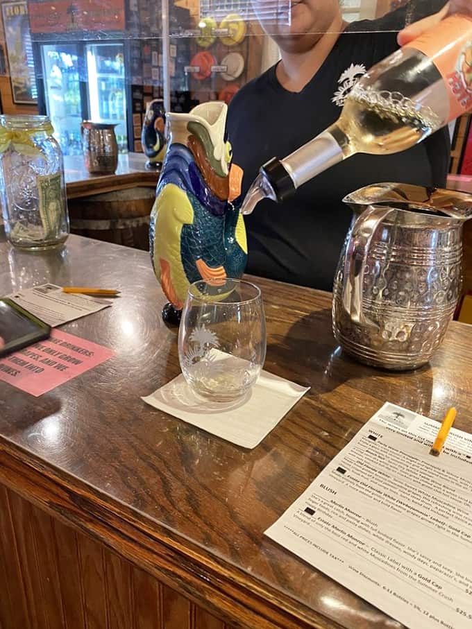 The tasting bar is where friendships are forged and wine knowledge is gained, one pour at a time, with laughter as the constant companion.