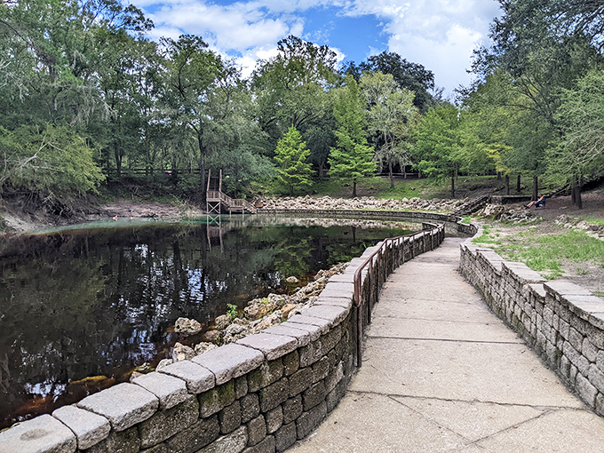 Engineering meets nature: a thoughtfully constructed walkway hugs the spring's contours, providing access while protecting the fragile ecosystem.