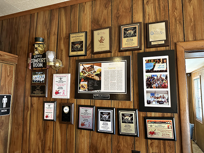 The wall of accolades tells a story of consistent excellence, each frame a chapter in Red Wing's legacy of culinary achievement and community connection.