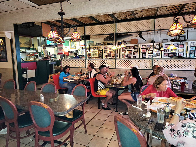 Happy diners lost in conversation and pasta &ndash; the true measure of a great restaurant isn't just the food, but the memories created.