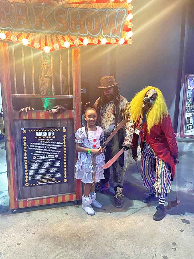Even the youngest visitors find their courage at Nightmare Village, flanked by characters who momentarily dial down the terror for a memorable photo.