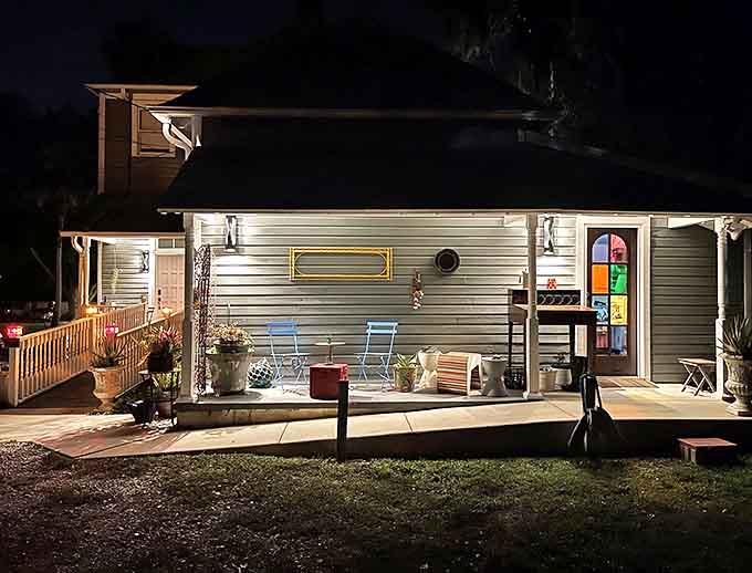 The back patio offers a peaceful retreat where guests gather under twinkling lights, sometimes hearing echoes of conversations from long ago.