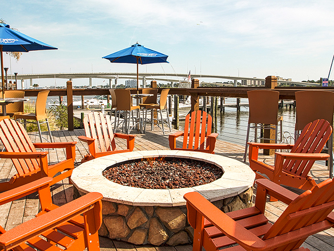 As evening falls, the fire pit surrounded by bright orange Adirondack chairs becomes the perfect spot for making new friends.