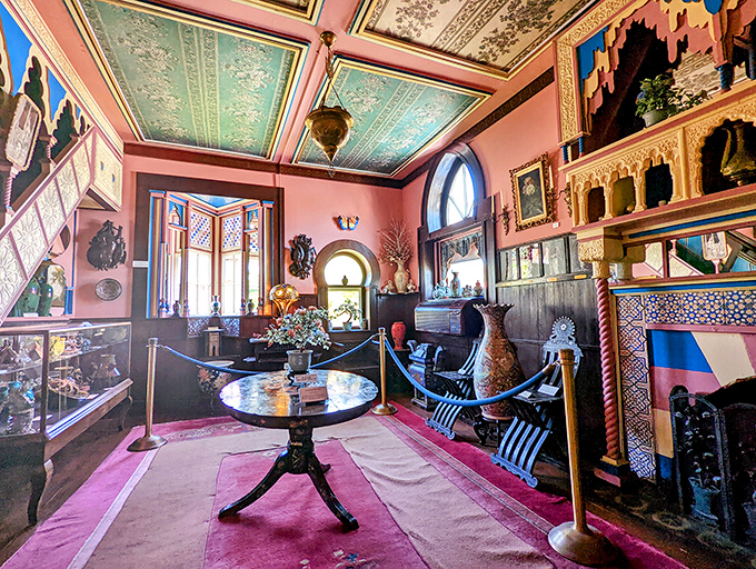 Salmon-colored walls provide the perfect backdrop for this collection room, where every artifact competes for your attention.