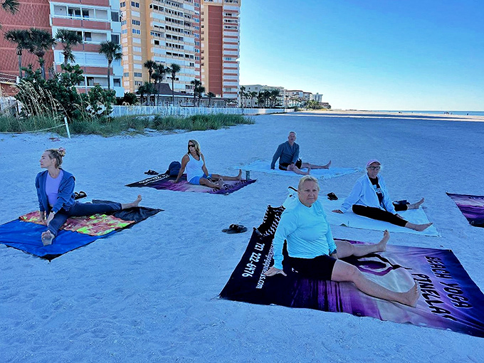 Beach yogis find comfort in seated poses, their mats creating islands of tranquility on the sand while they work on flexibility and mindfulness simultaneously.