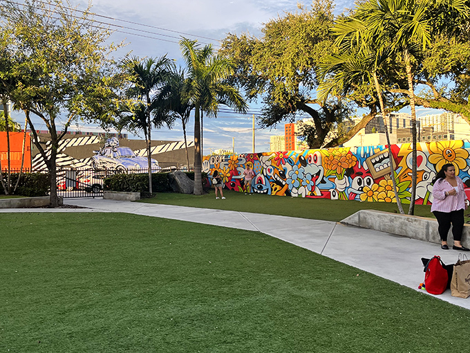 The perfectly maintained grounds create a gallery-like setting that lets the explosive wall art take center stage without distraction.