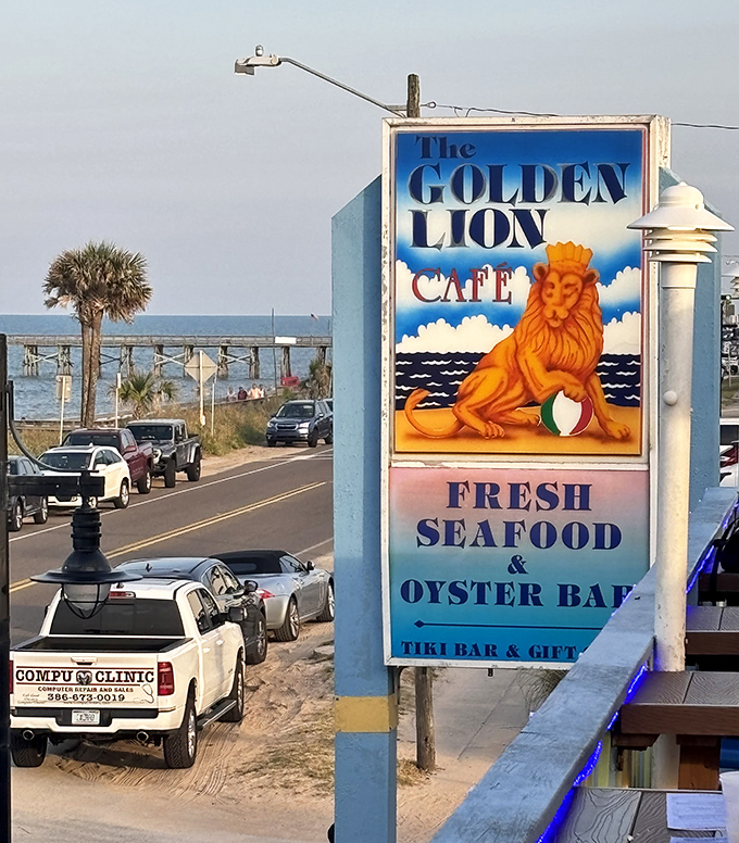 The iconic Golden Lion sign stands sentinel against the blue sky, promising fresh seafood and cold drinks to lucky passersby.