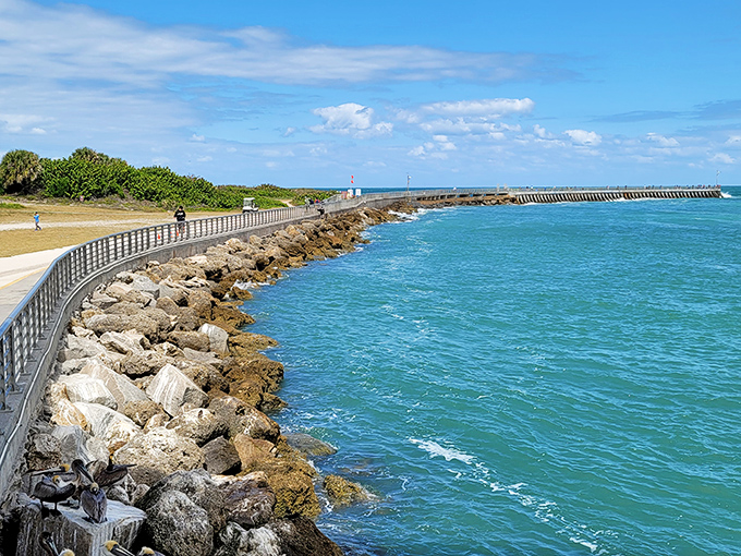 The turquoise waters curve along the shoreline, creating a postcard-perfect scene that no filter could improve.