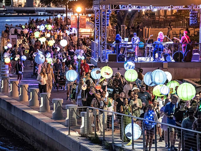 Lanterns illuminate Tampa's Riverwalk during Riverfest, creating a magical nighttime atmosphere along the Hillsborough River.