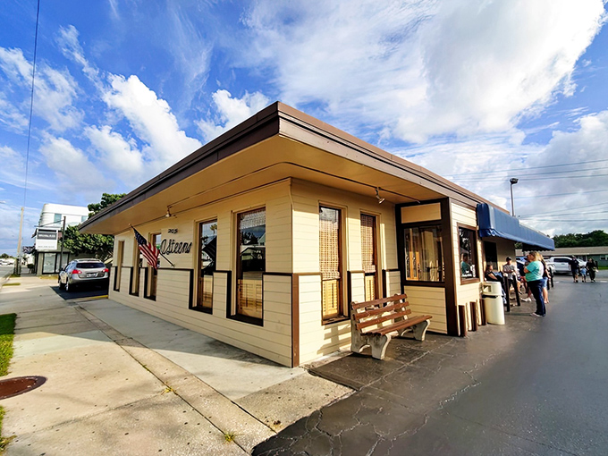 The American flag flies proudly outside O'Steen's, a no-frills spot where the focus is on perfectly fried shrimp rather than flashy decor.