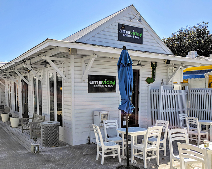Amavida Coffee serves as Seaside's community living room, where morning brews fuel days of adventure from a charming coastal cottage.