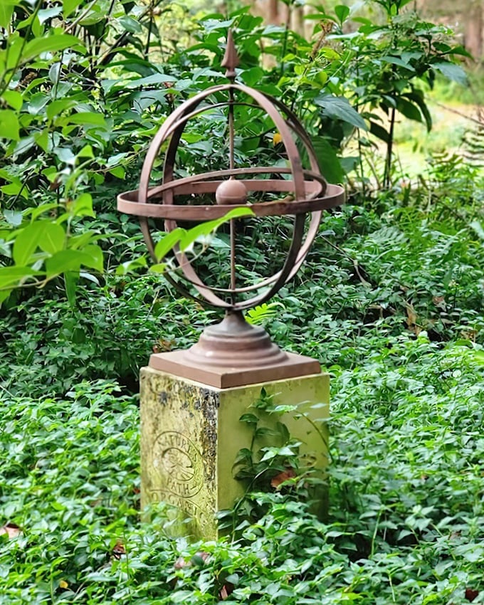 The armillary sphere stands as a silent timekeeper, its bronze rings marking the sun's journey across Lichgate's magical realm.