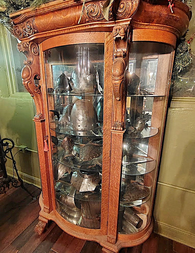 Medieval meets tropical in this cabinet of curiosities, where armor pieces stand at attention behind glass, guarding secrets of centuries past.