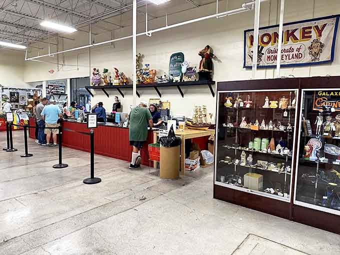 The checkout counter buzzes with activity as treasure hunters complete their quests, exchanging stories along with credit cards.