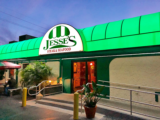 As evening falls, Jesse's entrance glows with promise, beckoning hungry patrons toward a char-grilled experience they won't soon forget.