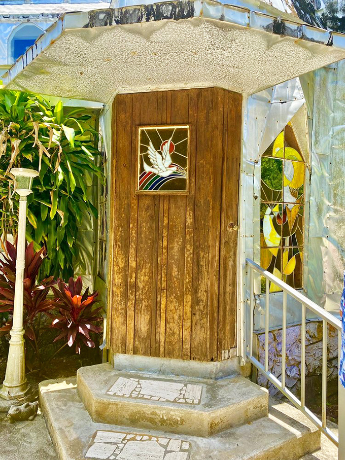 Stained glass details transform simple doorways into portals to imagination &ndash; each one a colorful surprise in this aluminum wonderland.