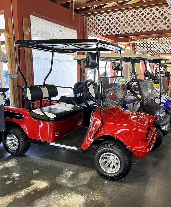 Candy-apple red golf carts gleam under market lights &ndash; retirement dreams on wheels for the Florida lifestyle seeker.