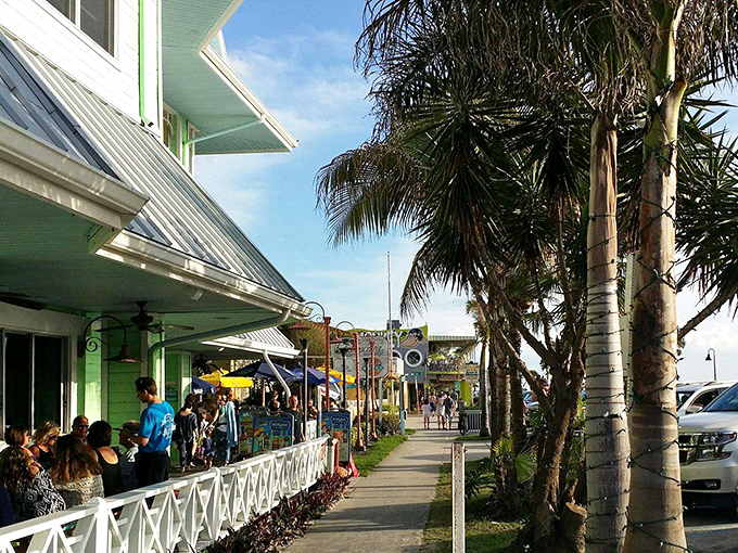 Palm-lined walkways and pastel buildings create the quintessential Florida scene that's been drawing visitors for generations.