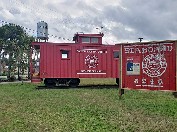 Historical Rail-Trail: This bright red caboose stands as a cheerful reminder of Inverness's railroad past, now a perfect trailhead photo op.