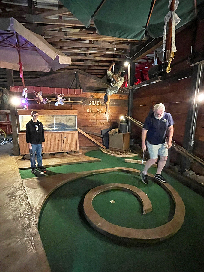 Indoor mini-golf at Boyett's takes putting to new dimensions, with rustic obstacles and hanging decorations that make par seem like a distant dream.