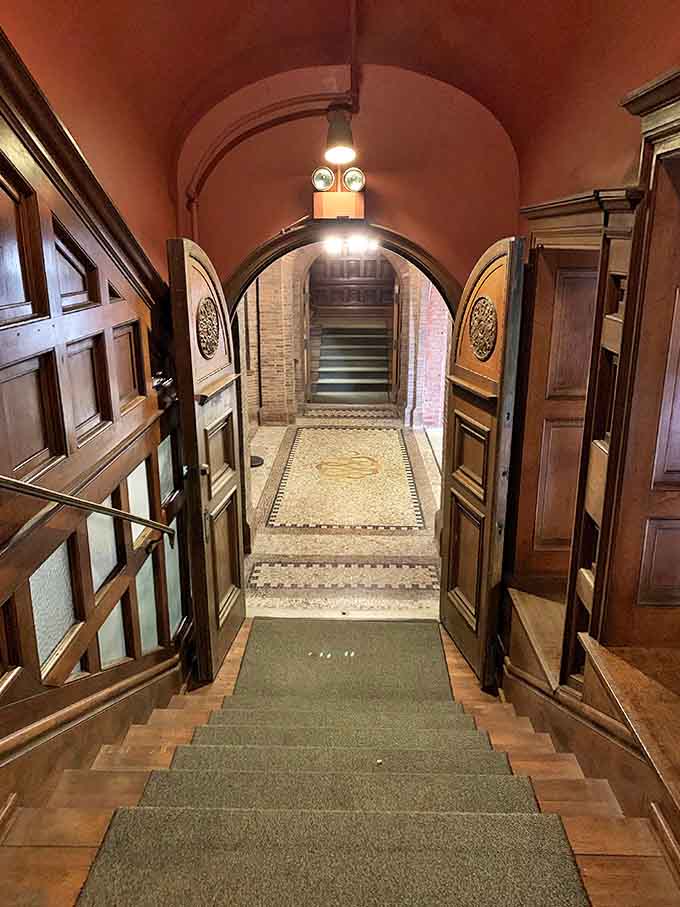 This interior stairwell arch frames the journey between floors &ndash; and possibly between dimensions if campus ghost stories are true.