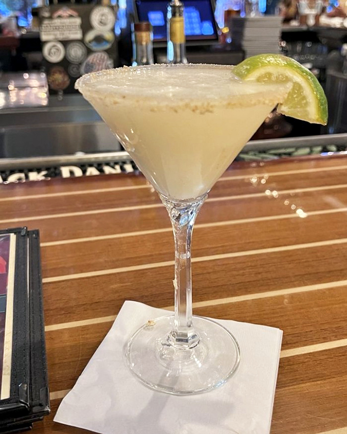 The Key West Margarita arrives with a salted rim and lime wedge &ndash; a refreshing tribute to Hemingway's beloved island paradise.