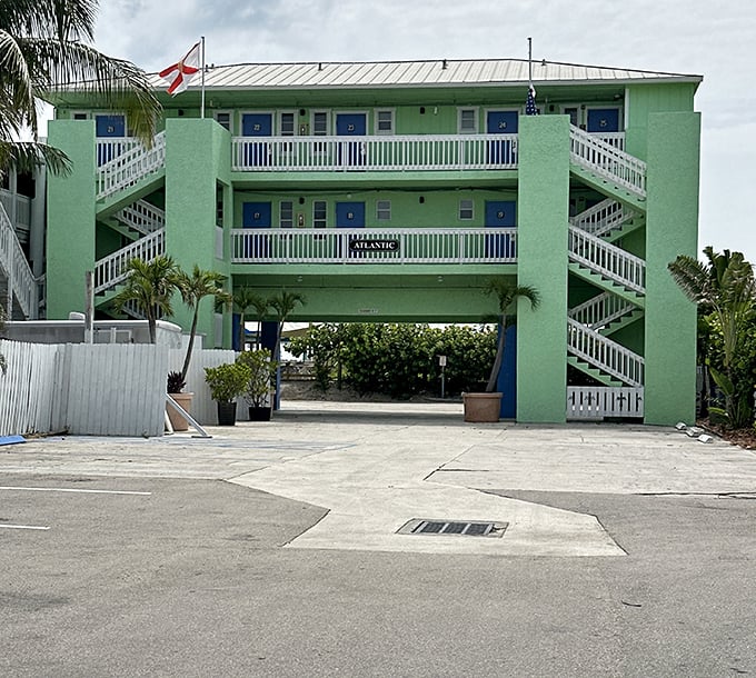 Mint-green walls and ocean-blue doors create the perfect Florida color palette at this charming beachfront escape.