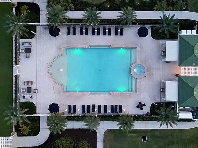 From above, the geometric perfection of the pool creates a striking contrast against the historic architecture &ndash; Florida's past and present in perfect harmony.
