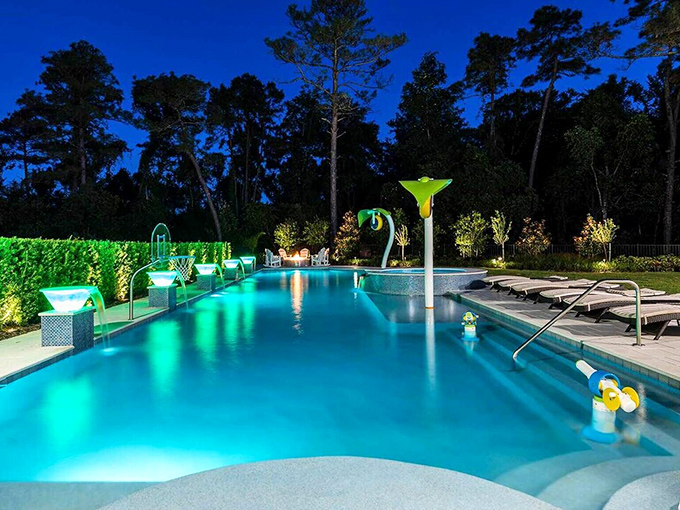As twilight falls, the pool transforms into a glowing blue oasis surrounded by Florida's natural beauty &ndash; magic hour, indeed.