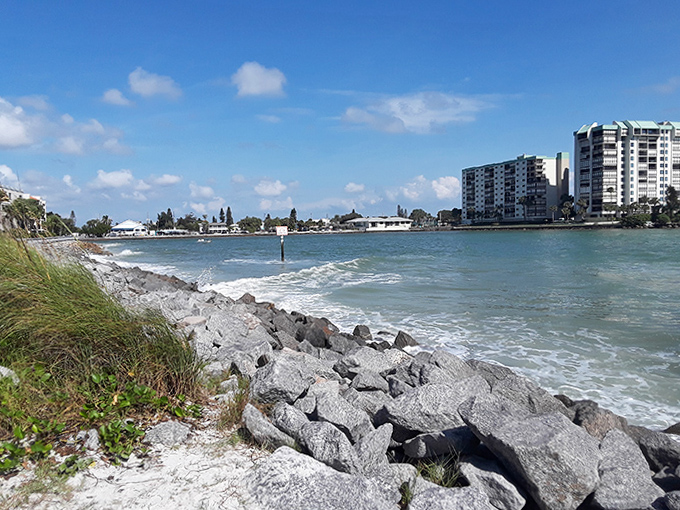 Where engineering meets nature – rocky shorelines protect waterfront properties while waves create a soothing soundtrack.