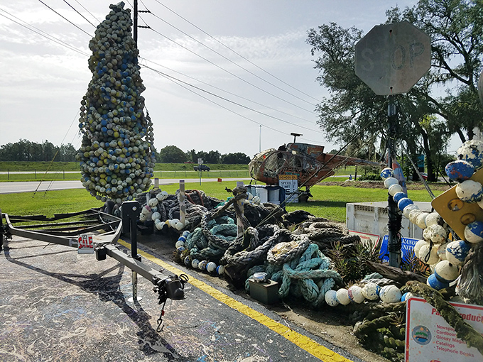 A tower of buoys stands like a Christmas tree for sea captains, transforming potential ocean pollution into an artistic statement.