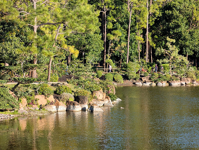 Where water mirrors sky and visitors mirror the peaceful expressions of the koi swimming below.