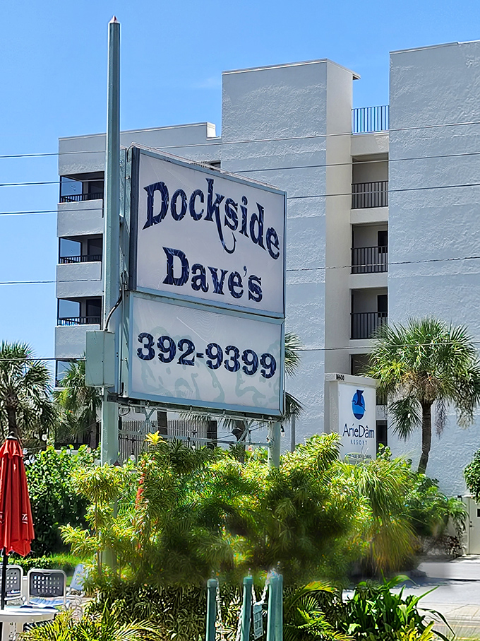 The Dockside Dave's sign stands as a beacon for seafood pilgrims seeking grouper nirvana along Madeira Beach's sun-drenched shores.