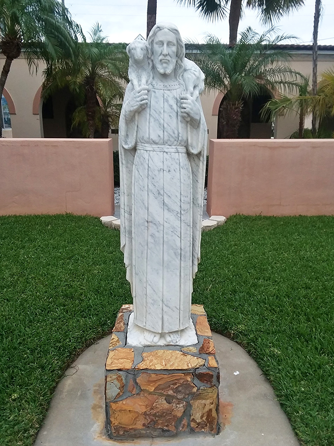 This statue of Jesus with a lamb offers a quiet spot for reflection amid the church's lush gardens.