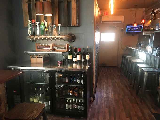 The bar area showcases the drink selection, where craft beers and creative cocktails wait to complement your meal perfectly.