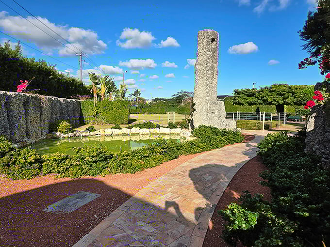Just look at that obelisk! A mysterious tower stands watch over the tranquil pond and winding brick pathways.