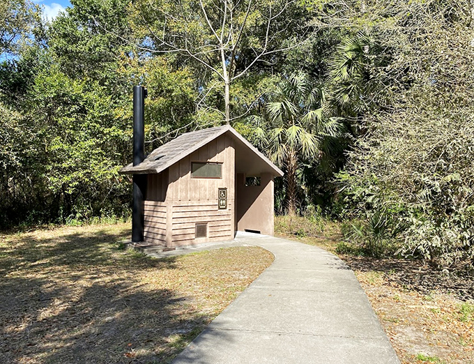 Even the restroom facilities blend harmoniously with the surroundings, proving that when nature calls, it prefers a scenic location.