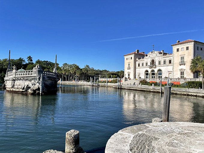 The villa's waterfront fa&ccedil;ade reflects in Biscayne Bay, doubling the beauty and making fish wonder about the real estate market.