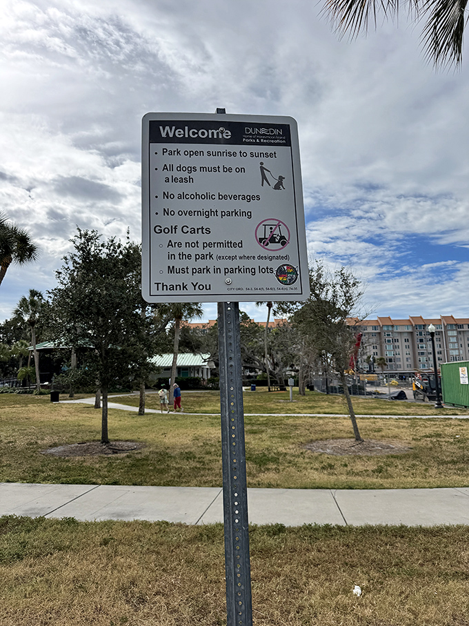 This sign politely reminds visitors that paradise has operating hours &ndash; even Eden probably had some basic ground rules.