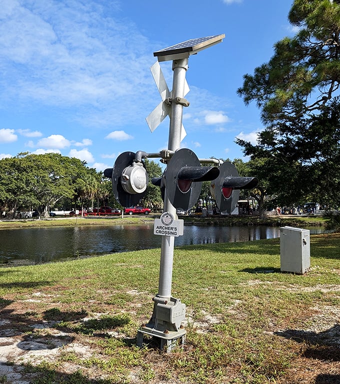 Archer's Crossing signal stands sentinel over the tracks. These working miniature signals add authentic railroad atmosphere to this charming scaled-down world.