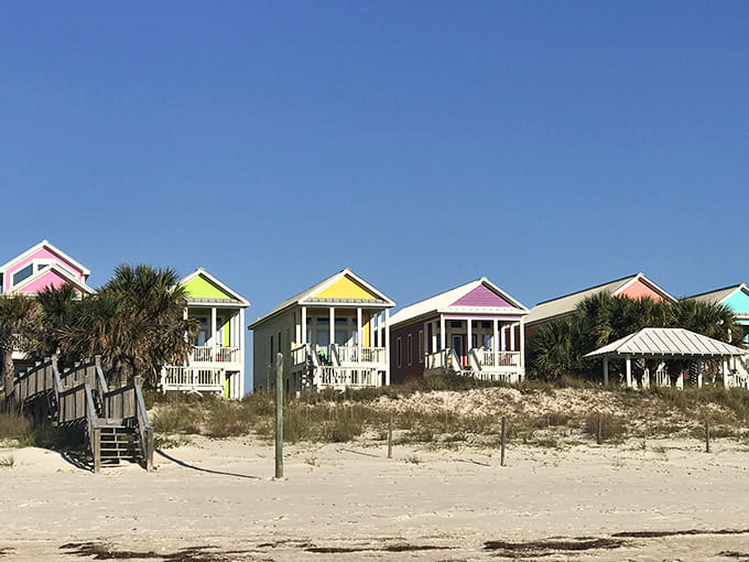 Beachfront vacation rental cottages: A rainbow of coastal homes standing like tropical fruit drops along sugar-white sands. Architectural joy in every hue.