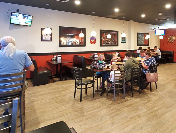 The restaurant creates a welcoming atmosphere where families and friends gather to share not just pizza, but quality time together.