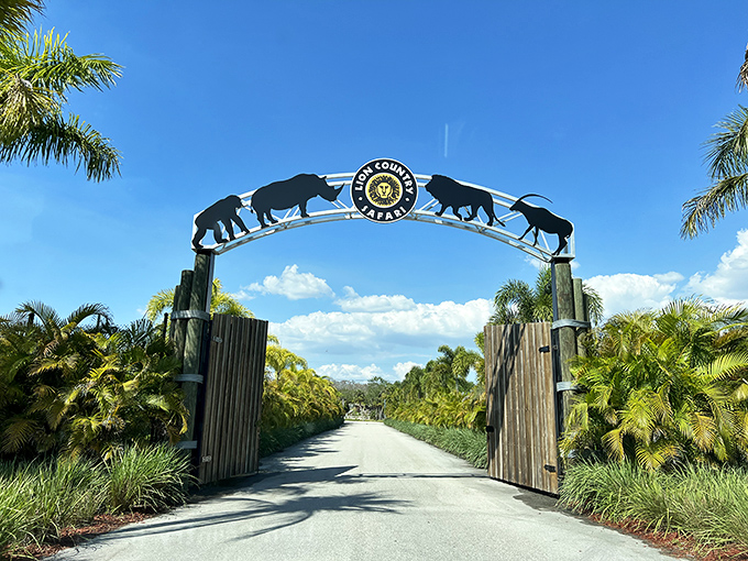 The iconic entrance arch serves as a portal between ordinary life and safari adventures, where wilderness and water slides await.