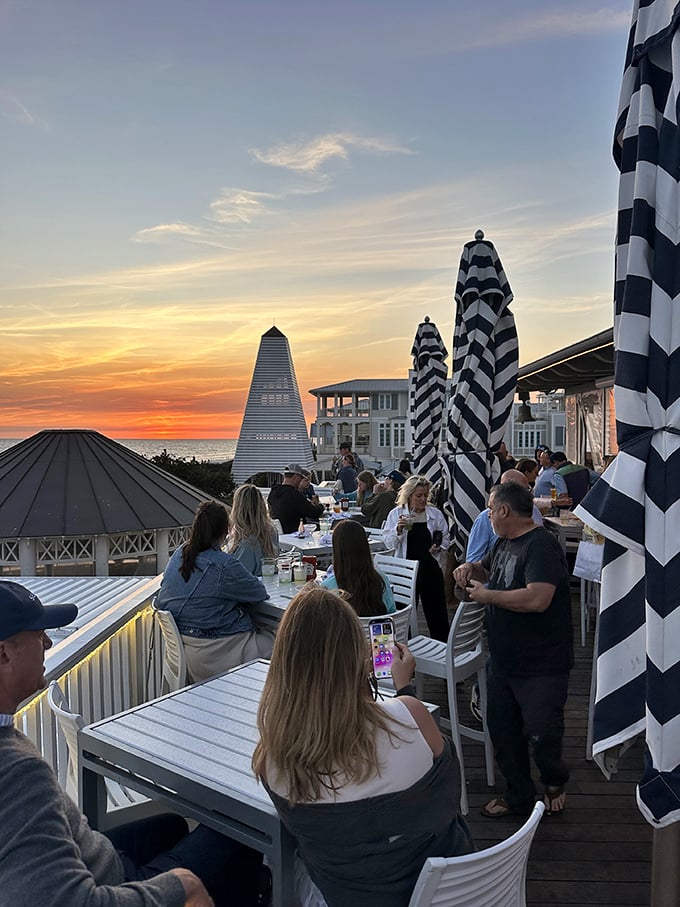 Guests: Sunset worshippers gather for the nightly show &ndash; cocktails in hand, cameras ready, creating memories that will last through winter.