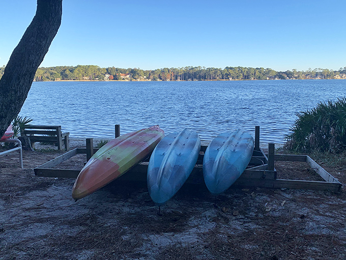 Colorful kayaks waiting for their next adventure &ndash; your ticket to exploring Rocky Bayou's secluded coves.
